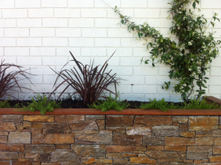 Cladding on a retaining wall for extra effect - Phillips Landscapes